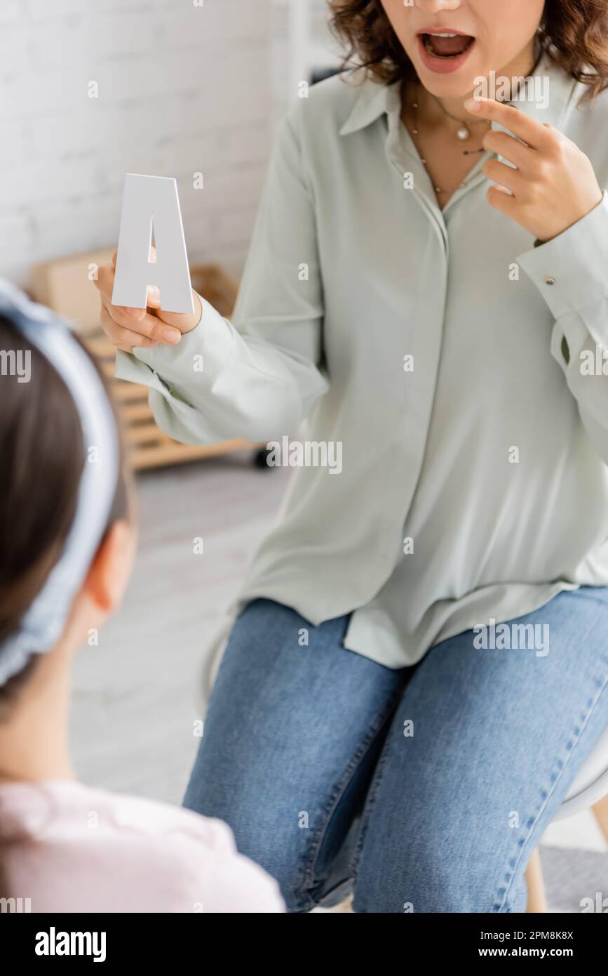 Adult finger pointing at a letter hi-res stock photography and images ...
