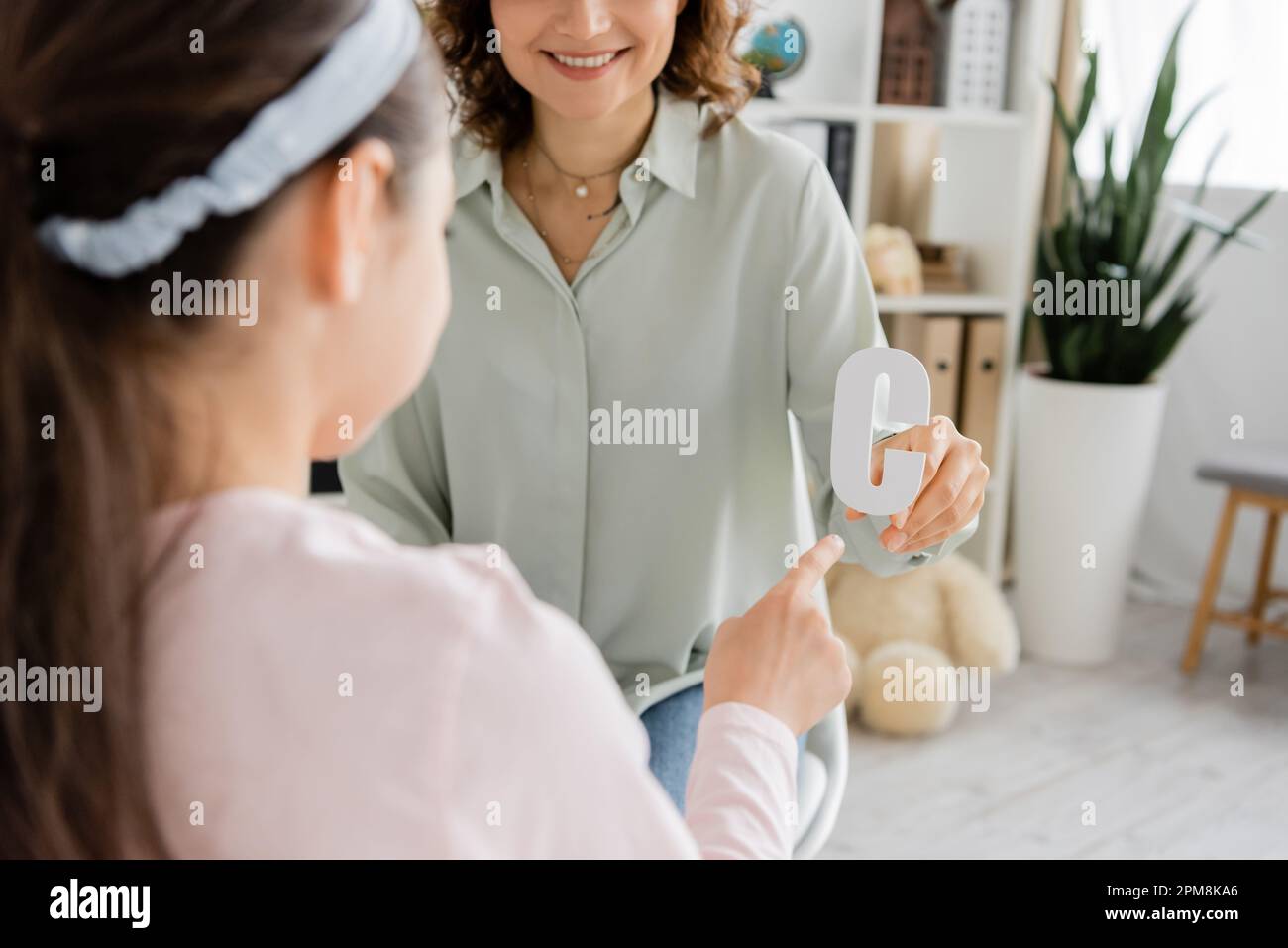 Finger pointing at letter hi-res stock photography and images - Alamy