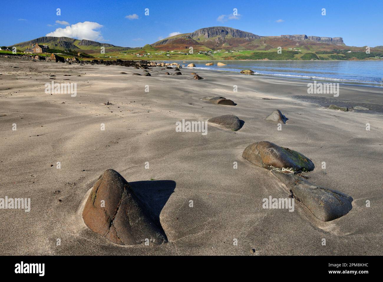 Staffin Beach, north Skye with the Quiraing and Trotternish ridge in ...
