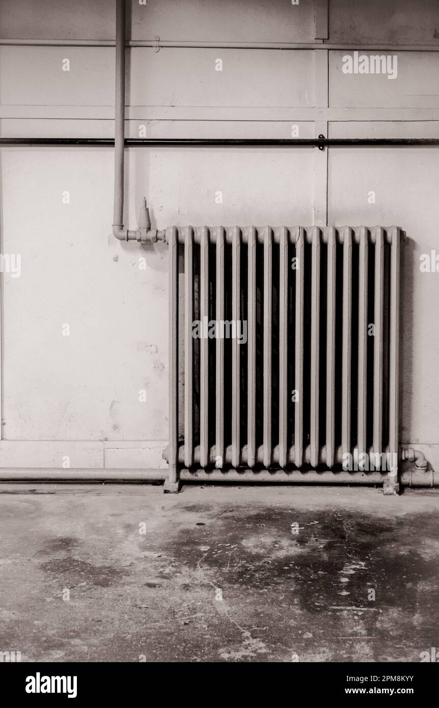 1940s World War 2 era style heavy duty radiator in a hut on a concrete ...
