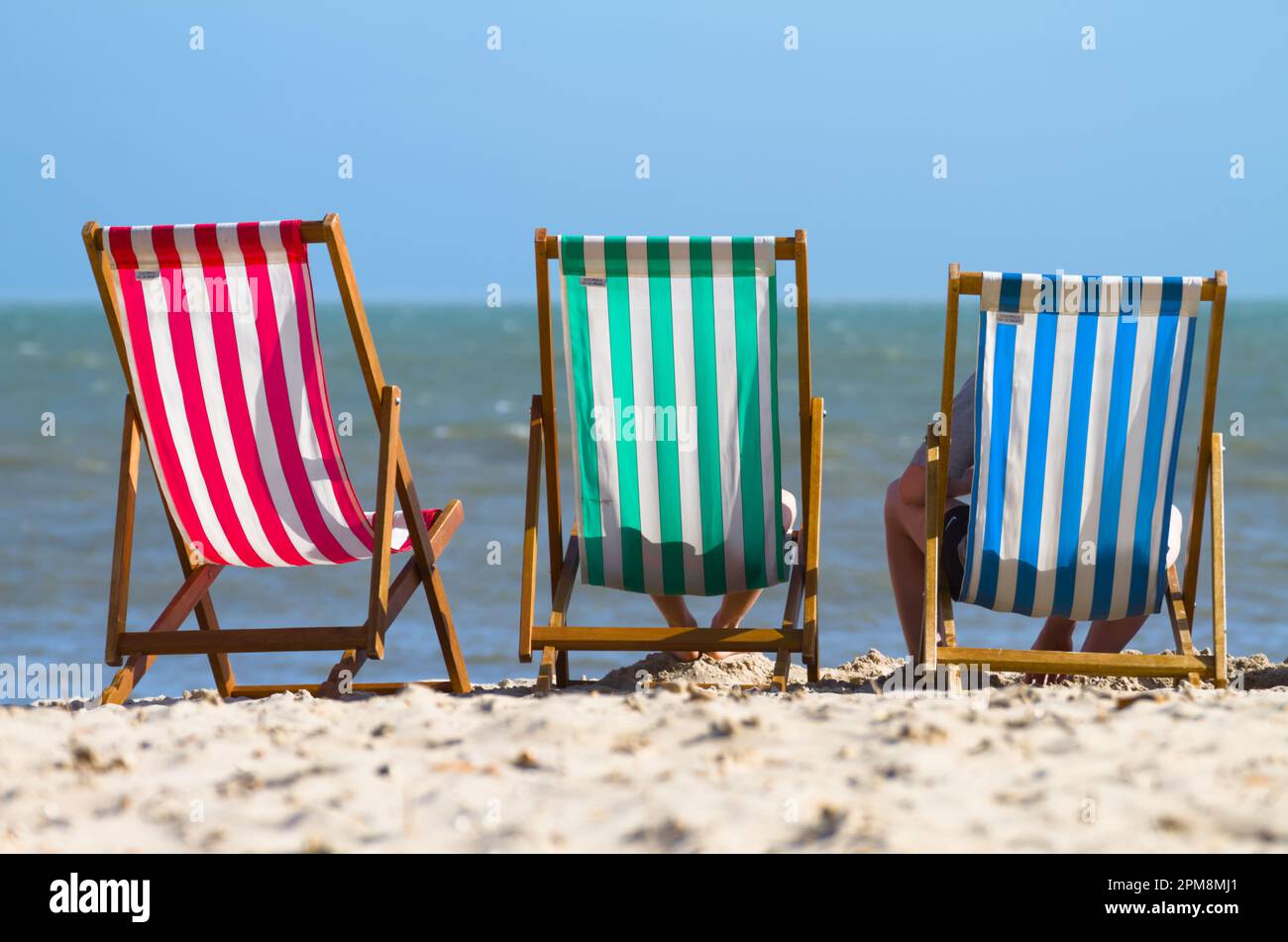 Three Striped Coloured Deckchairs On A Sandy Beach On A Sunny Day, Avon ...