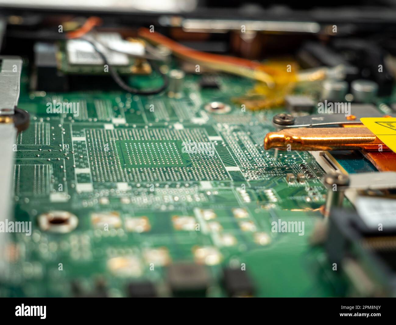 Electronic board of an old broken laptop. Dusty broken laptop under ...