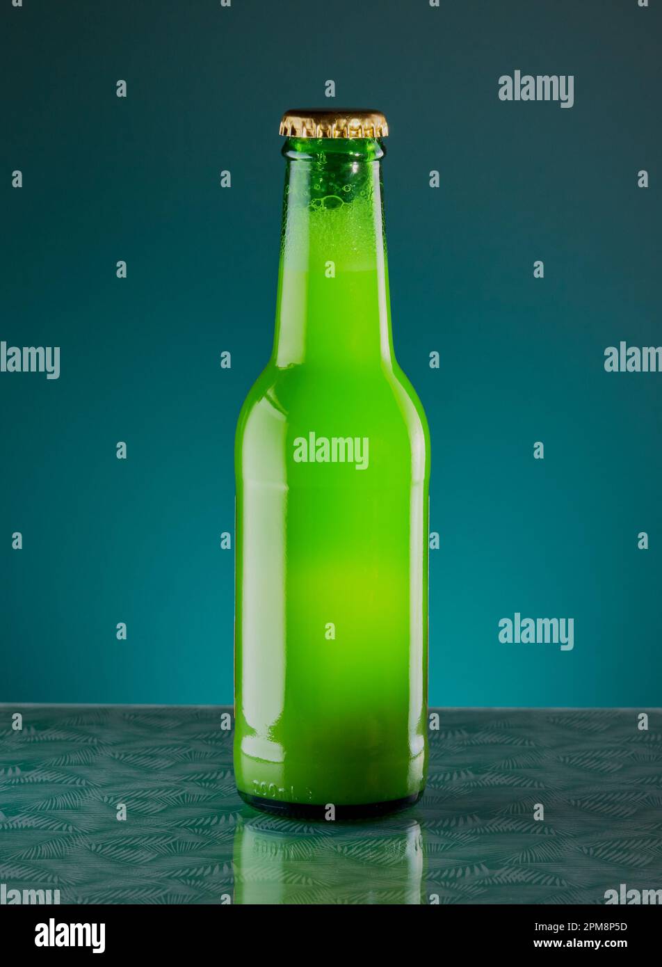 Bottle of unbranded beer with a cool blue gradient background Stock ...