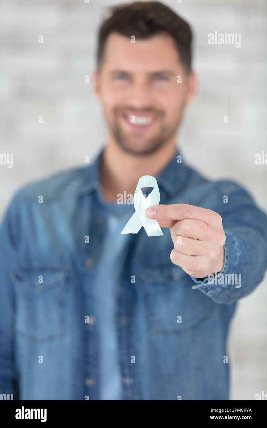 Awareness white ribbon symbol violence hi-res stock photography and ...