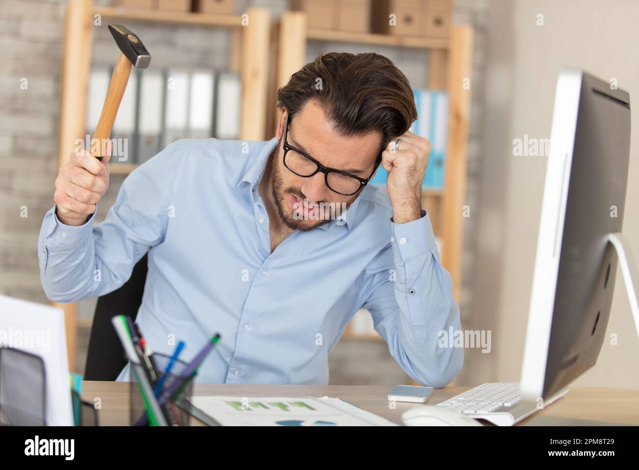 angry businessman working in the office Stock Photo - Alamy
