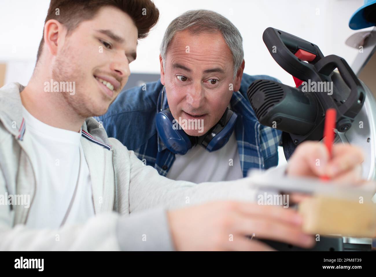 apprentice wood worker and his teacher Stock Photo - Alamy