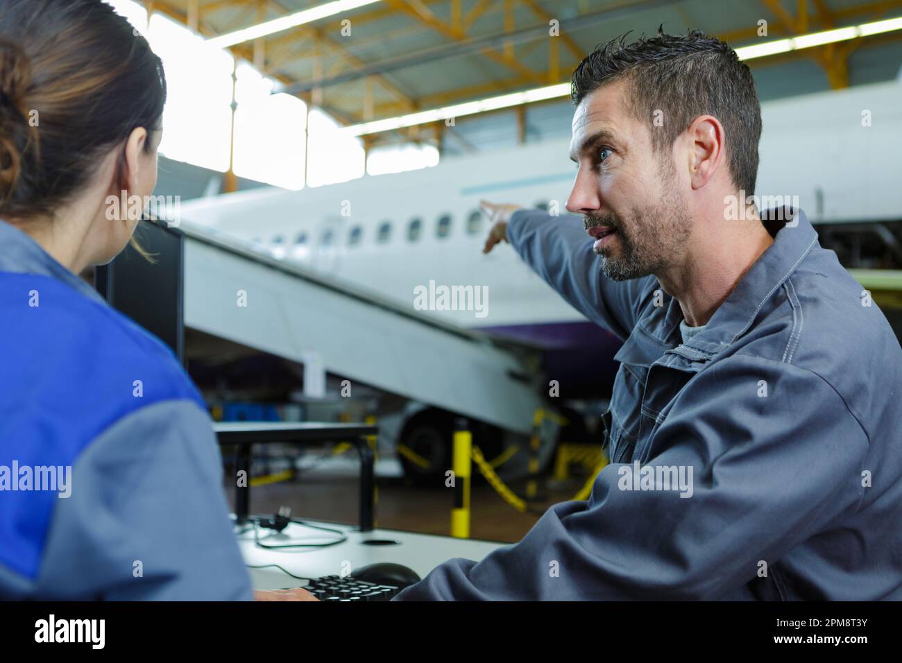 Man woman repairing aircraft hi-res stock photography and images - Alamy