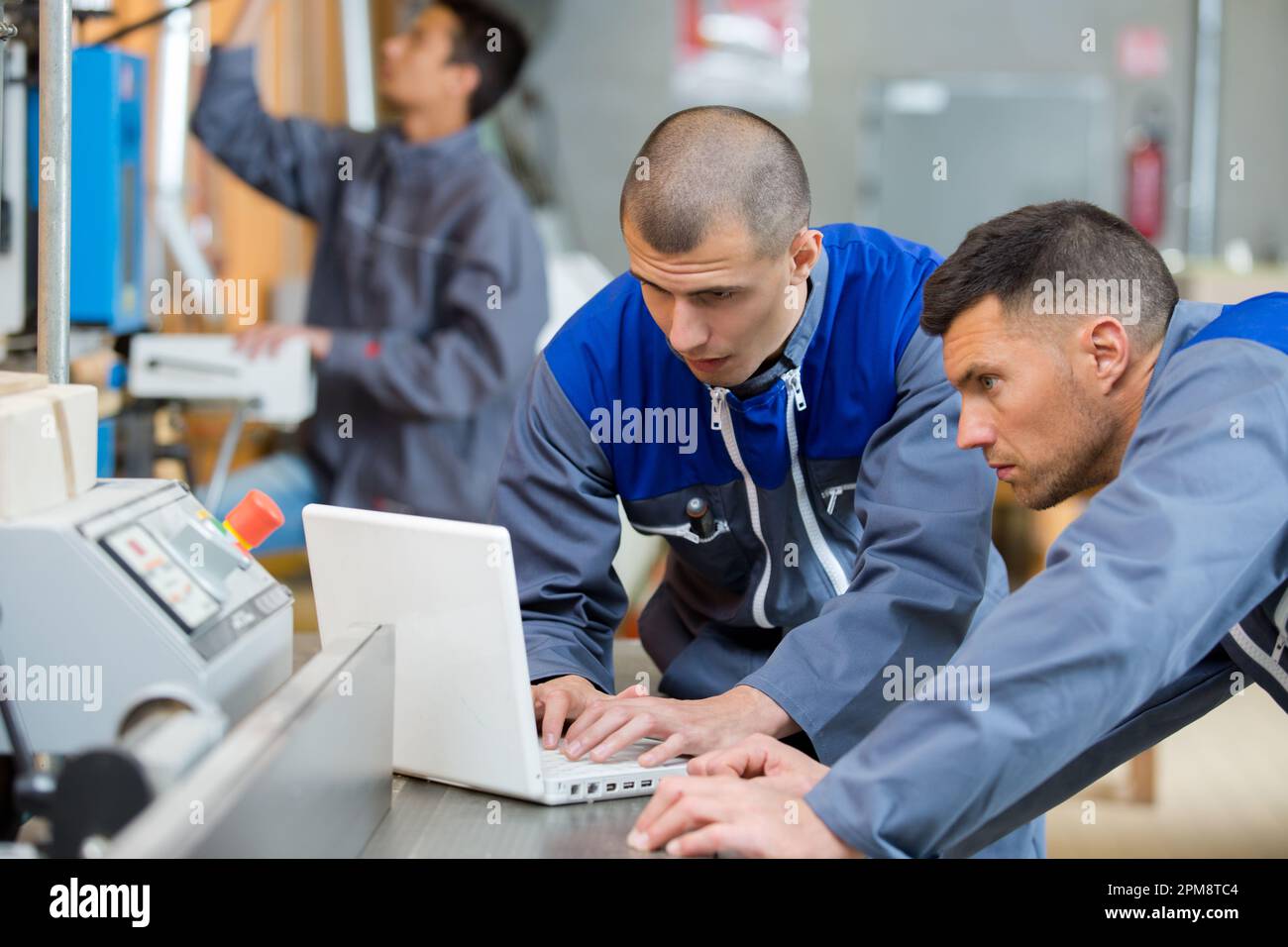 engineering apprentice in the workshop with teacher Stock Photo - Alamy