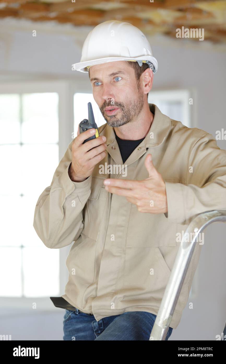 engineering man using walkie talkie Stock Photo - Alamy