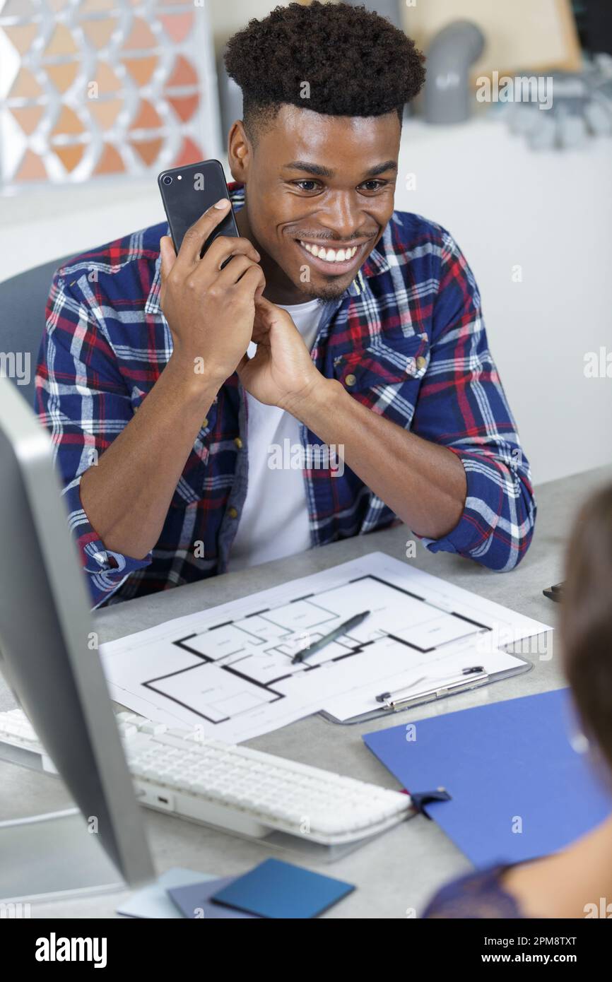 construction engineer working with blueprints and customer Stock Photo ...
