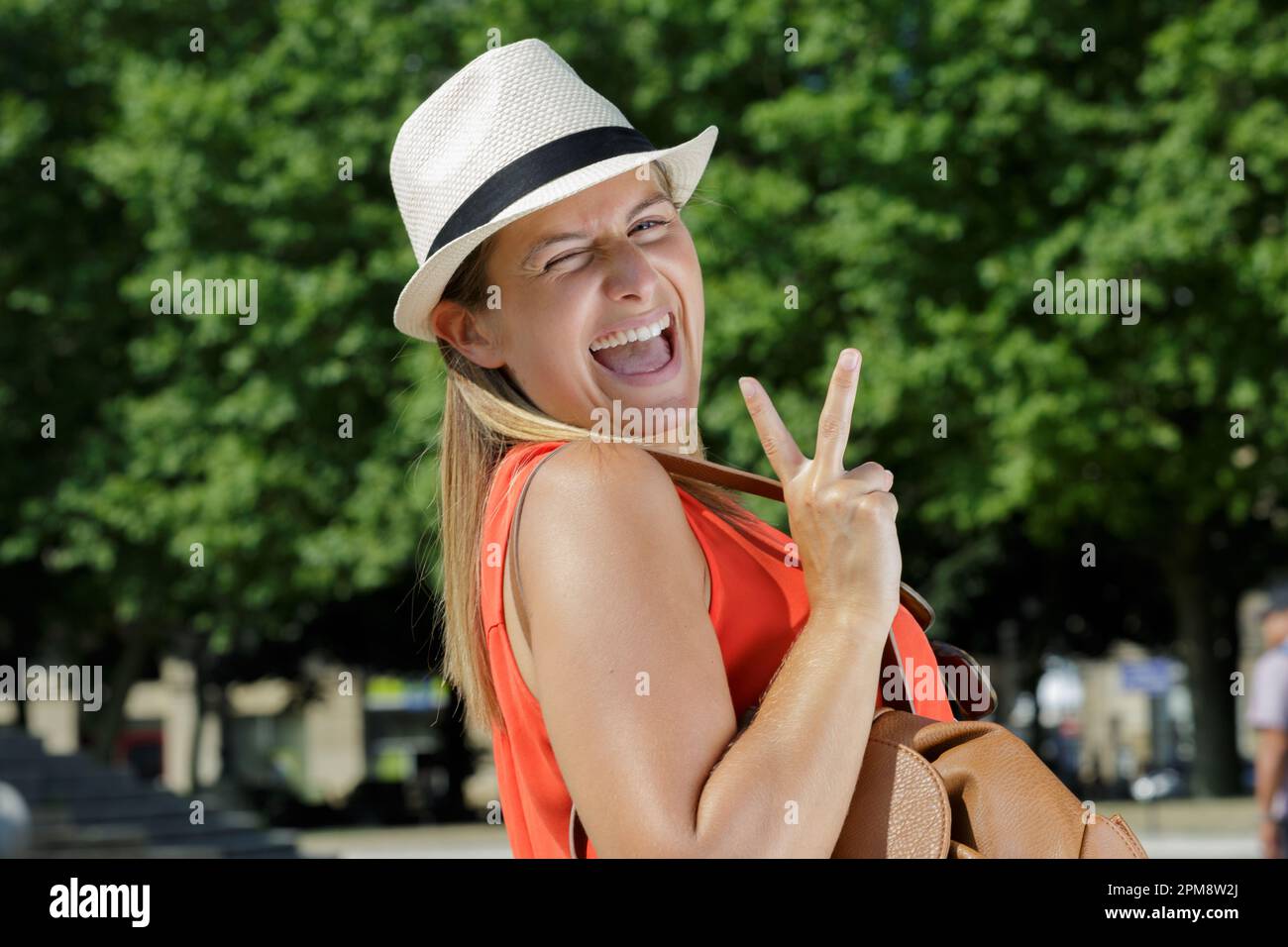 victory sign by beautiful female winner Stock Photo - Alamy