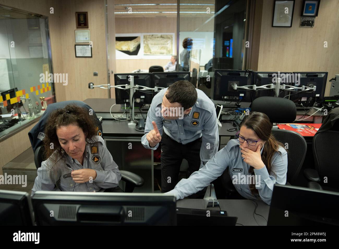 Workers of the Protecció Civil team during a test of sending mass ...