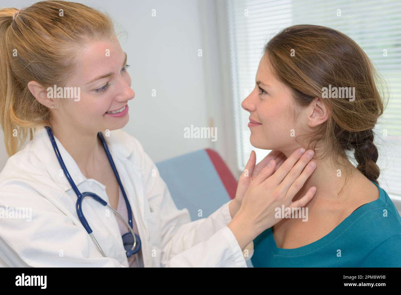 doctor feeling patients glands Stock Photo - Alamy