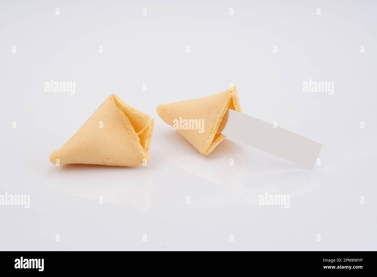Two fortune cookies with a blank paper slip inside, perfect for adding ...