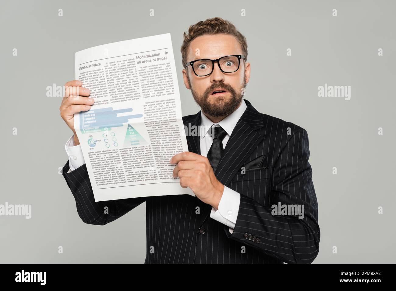 shocked businessman in suit and glasses holding newspaper isolated on ...