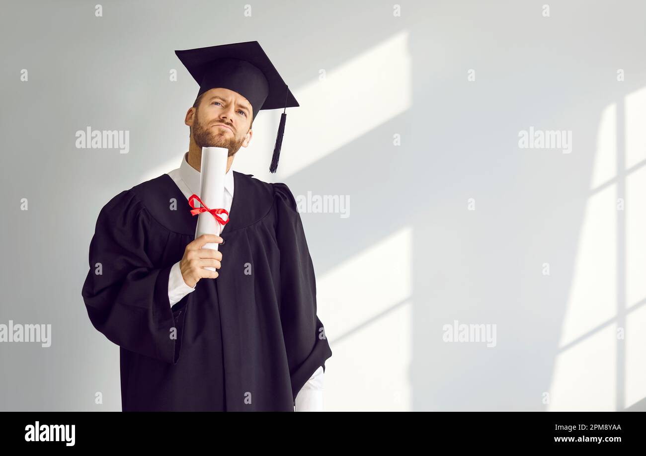 Confused, doubting university graduate thinking about career on copy ...