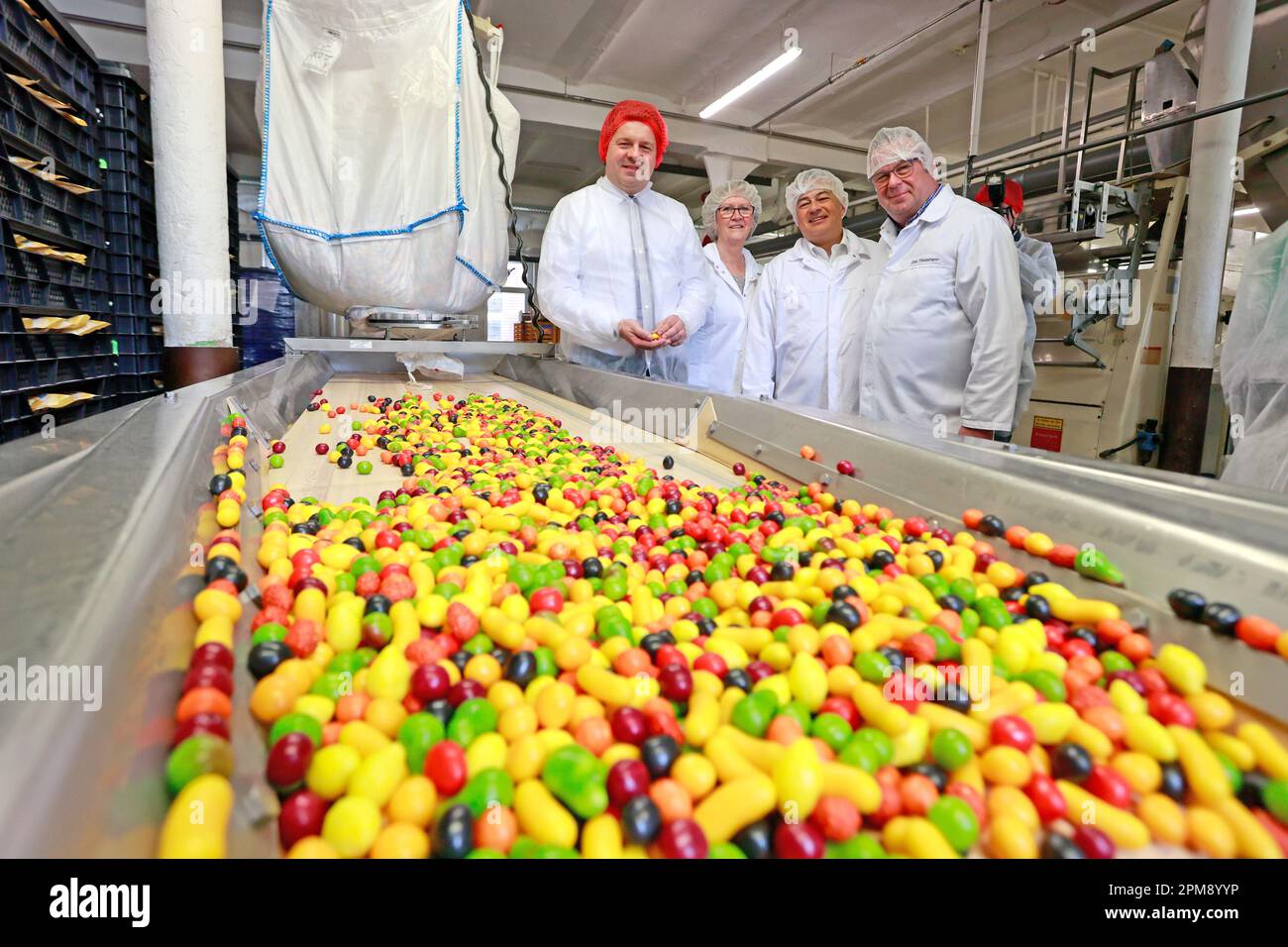 12 April 2023, Saxony-Anhalt, Oschersleben: Colorful dragées run across ...