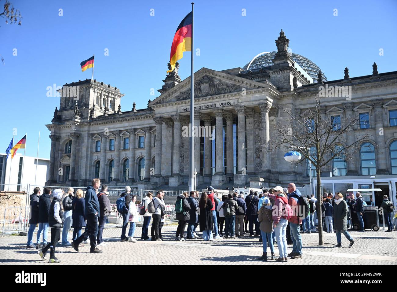 Berlin, Germany. 12th Apr, 2023. People wait in line to enter the ...