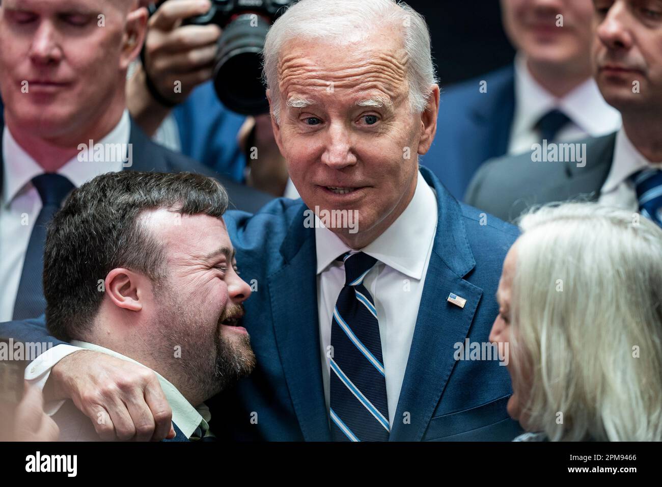 US President Joe Biden embraces James Martin, who starred in the recent ...