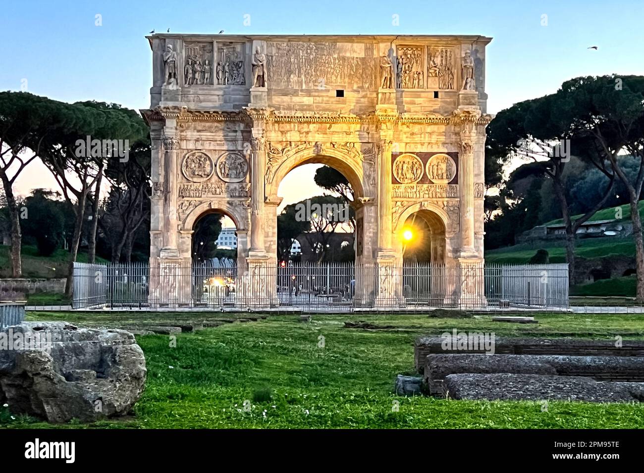 A breathtaking view of the Arch of Constantine in Rome, illuminated by ...