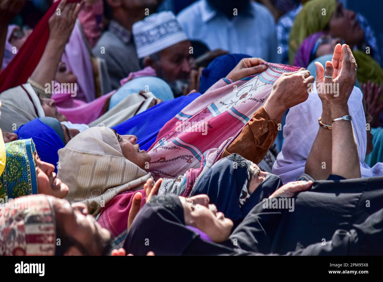 Srinagar, India. 12th Apr, 2023. Kashmiri Muslims pray as a priest (not ...