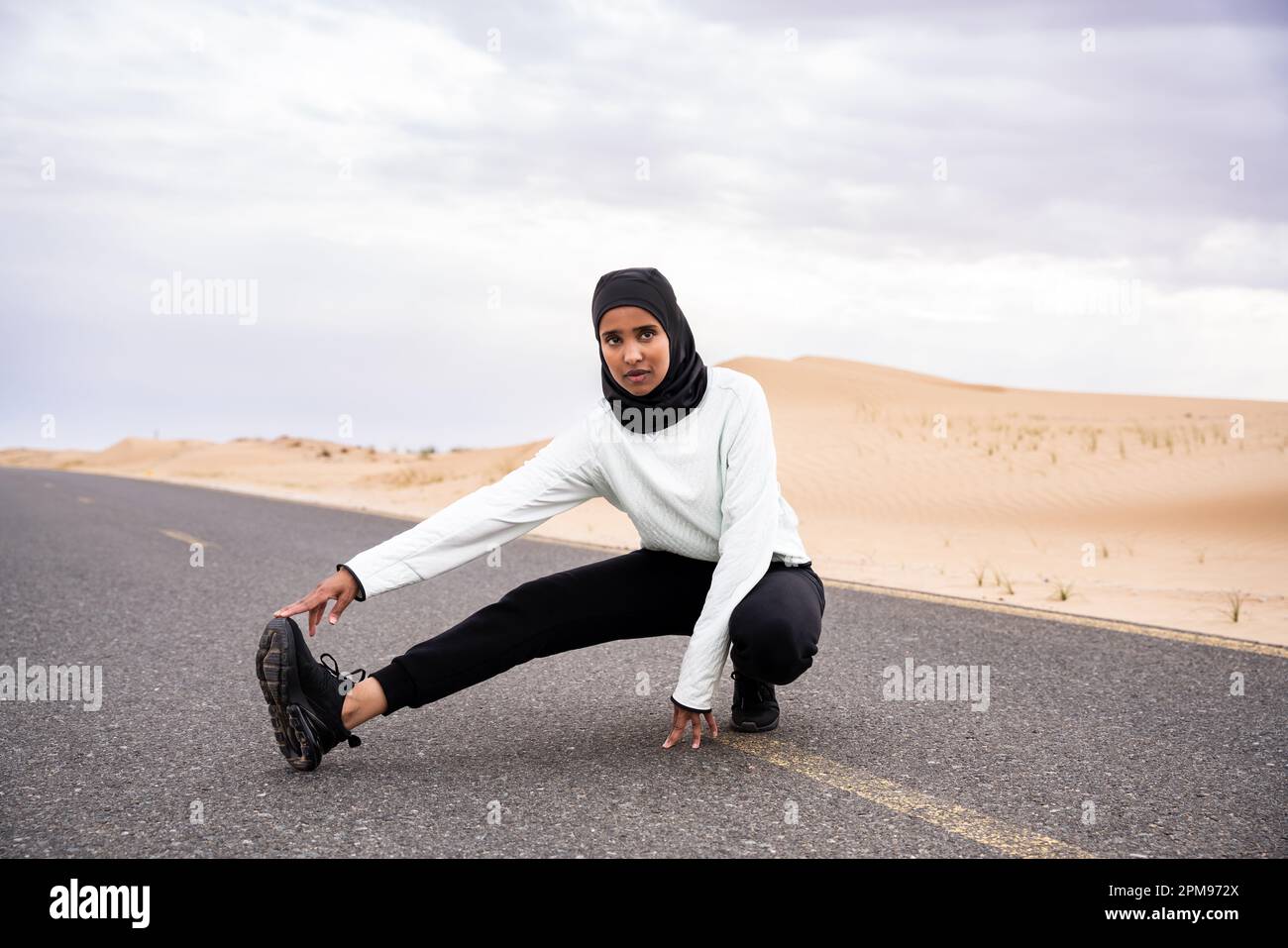 Beautiful middle-eastern arab woman wearing hijab training outdoors in ...