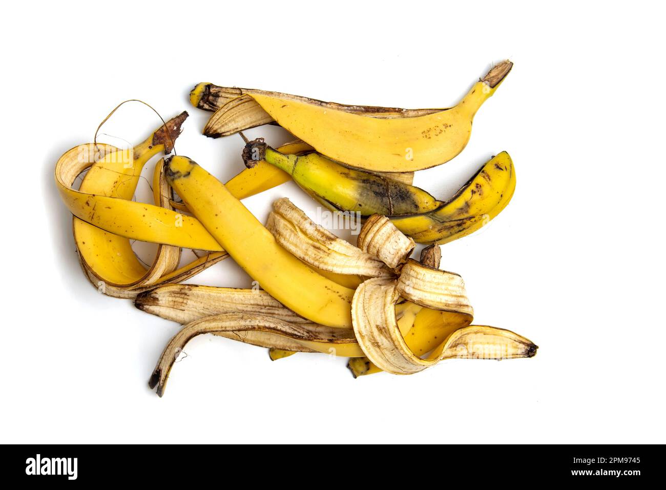 Banana peels on a white background Stock Photo - Alamy