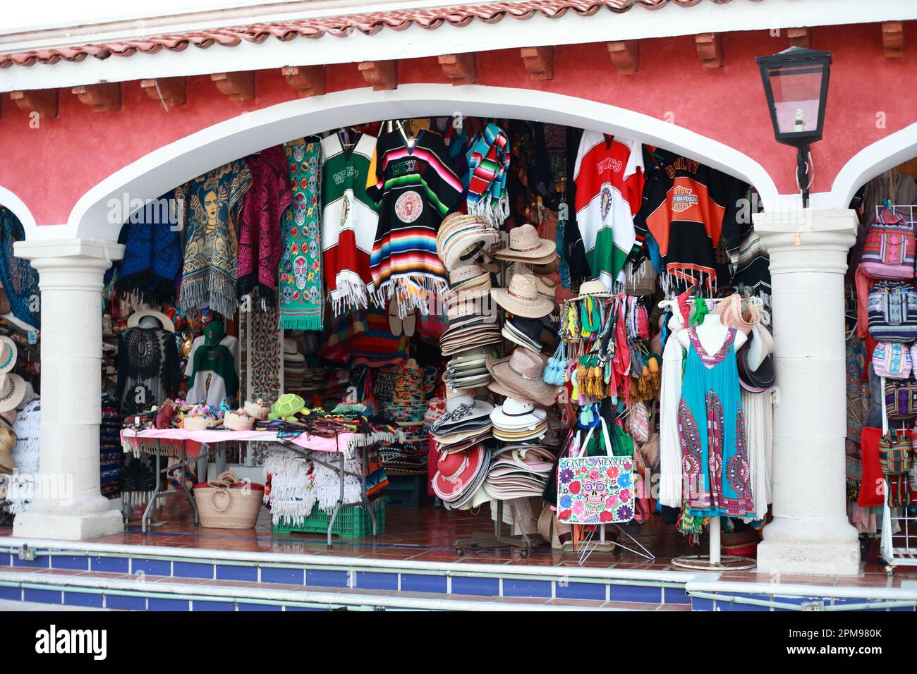 Choice of hats, clothes and souvenirs for sale in a shop at the ...