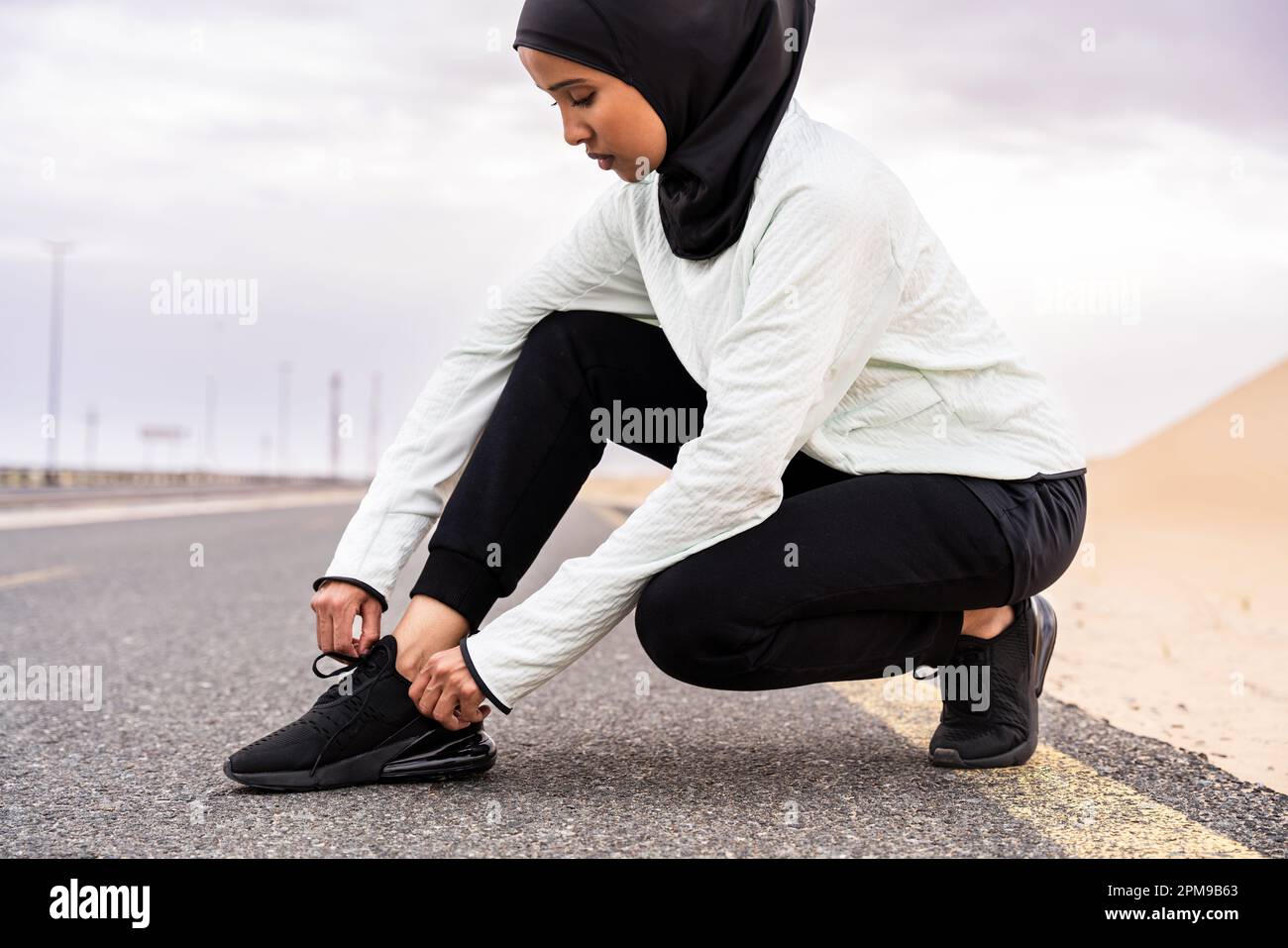 Beautiful middle-eastern arab woman wearing hijab training outdoors in ...