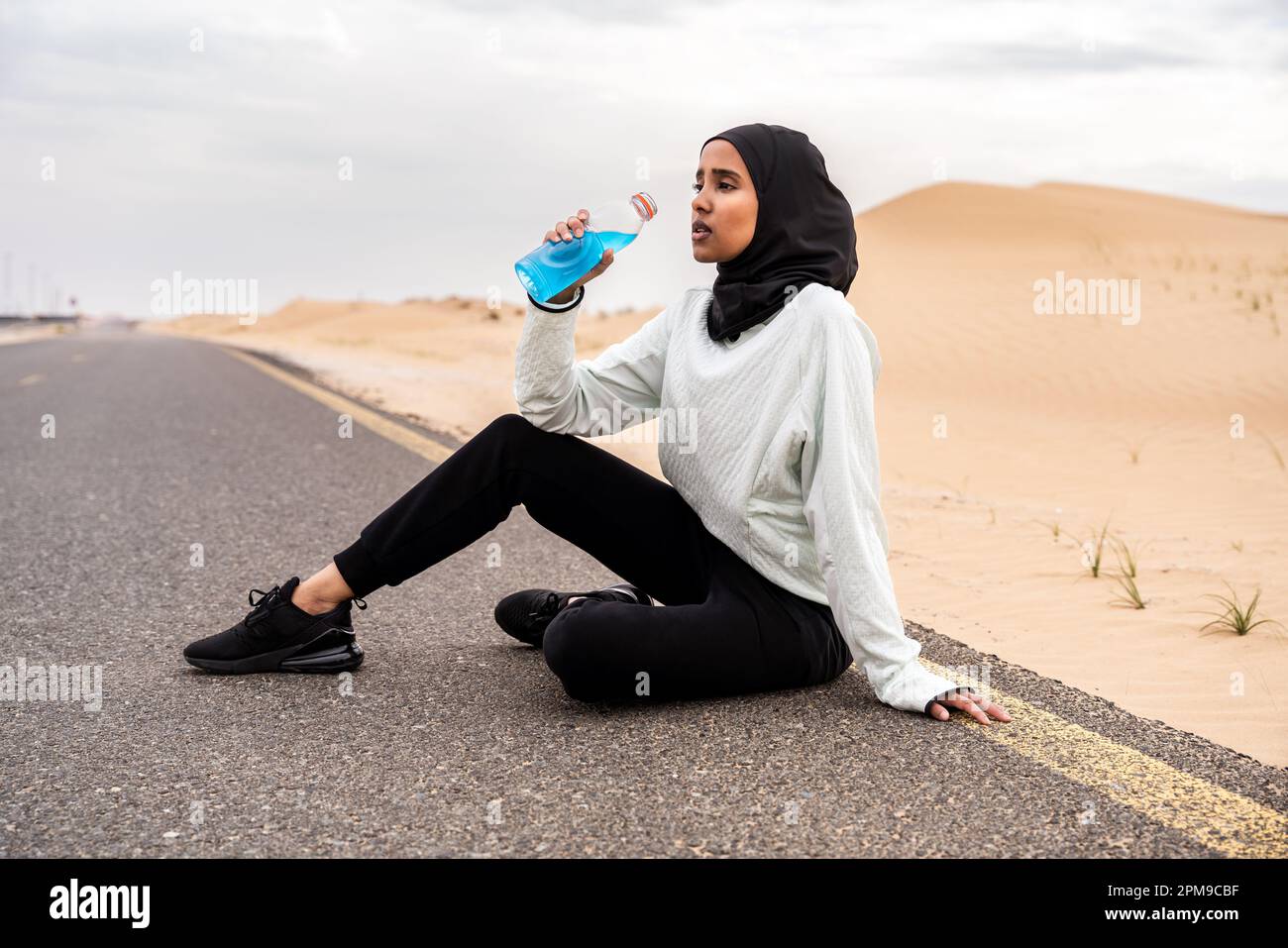 Beautiful middle-eastern arab woman wearing hijab training outdoors in ...