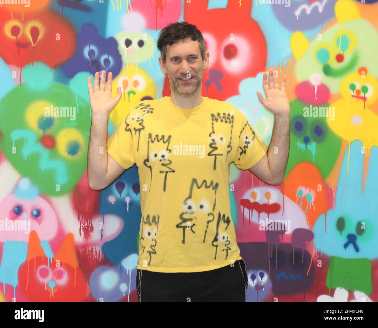 London, UK. British born artist Jon Burgerman poses with his painting ...