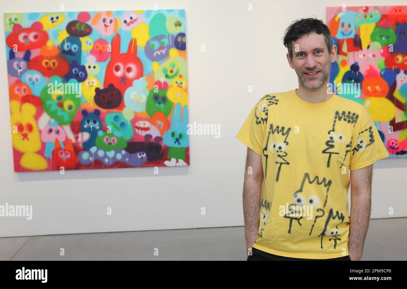 London, UK. British born artist Jon Burgerman poses with his painting ...