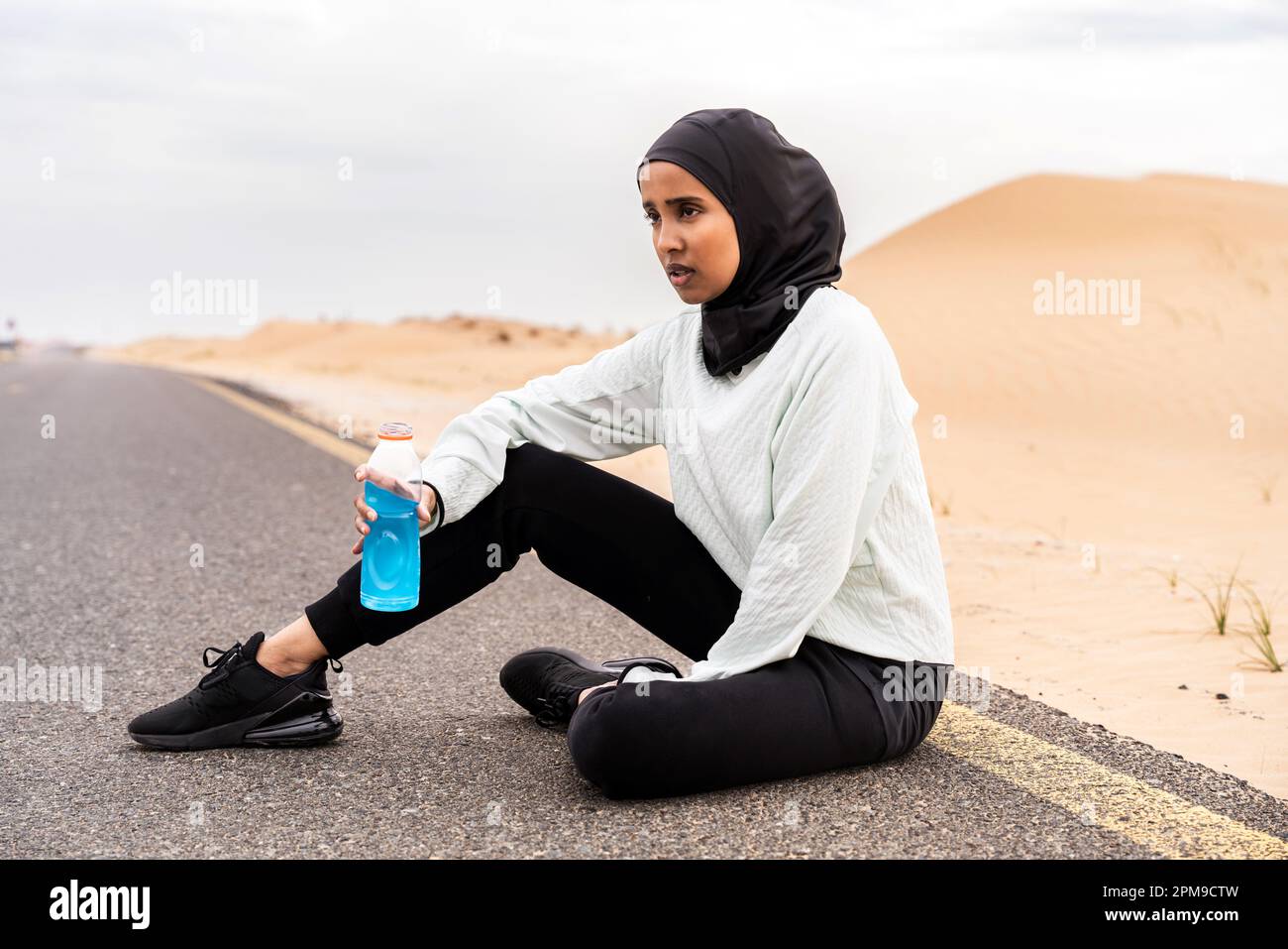 Beautiful middle-eastern arab woman wearing hijab training outdoors in ...