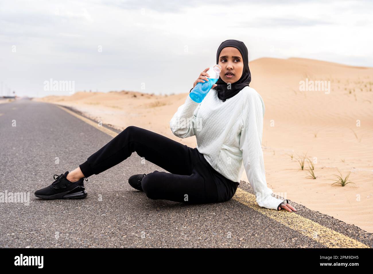 Beautiful middle-eastern arab woman wearing hijab training outdoors in ...