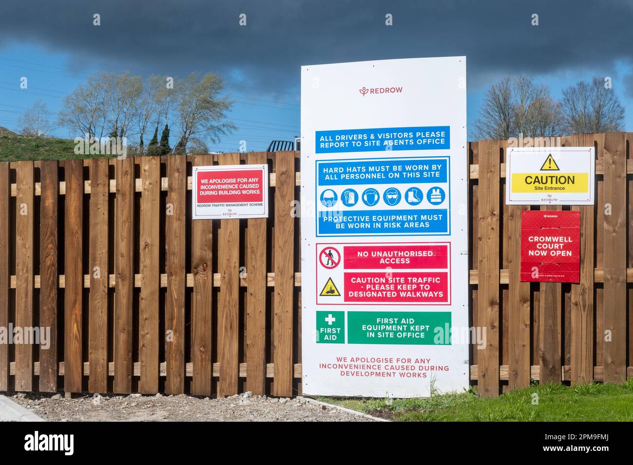 A collection of signs and health and safety notices on a board around a ...