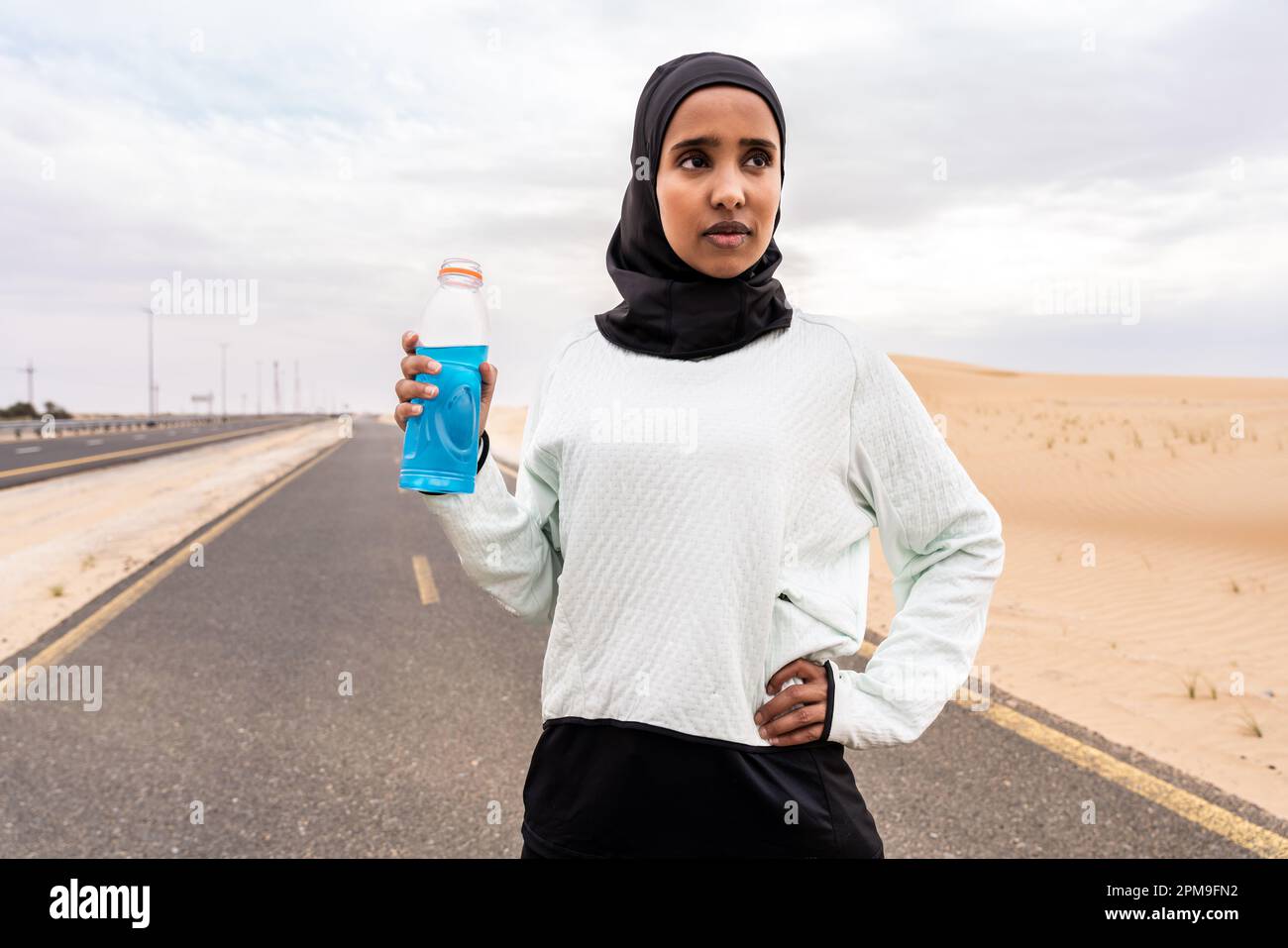 Beautiful middle-eastern arab woman wearing hijab training outdoors in ...