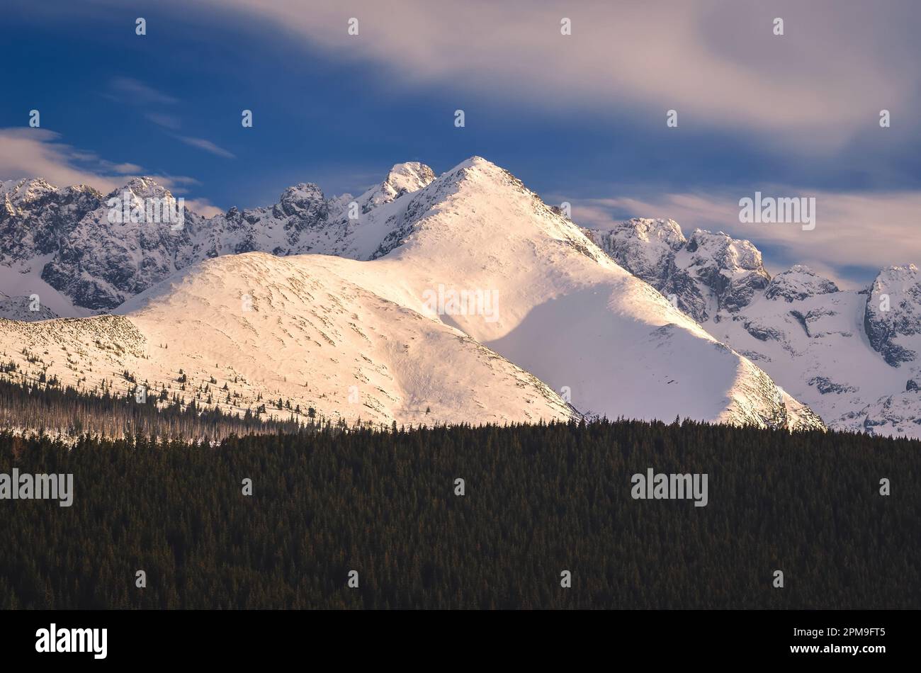 Beautiful early spring mountain landscape. View of the snow-white peaks ...