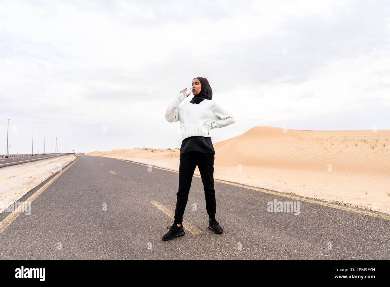 Beautiful middle-eastern arab woman wearing hijab training outdoors in ...