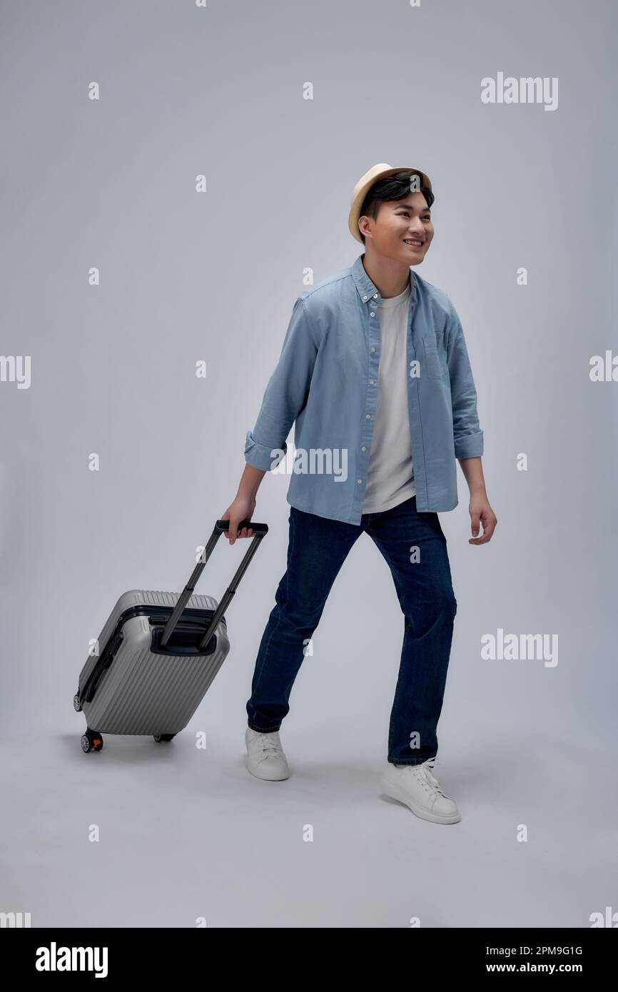 Full size photo of young man happy positive smile travel abroad ...