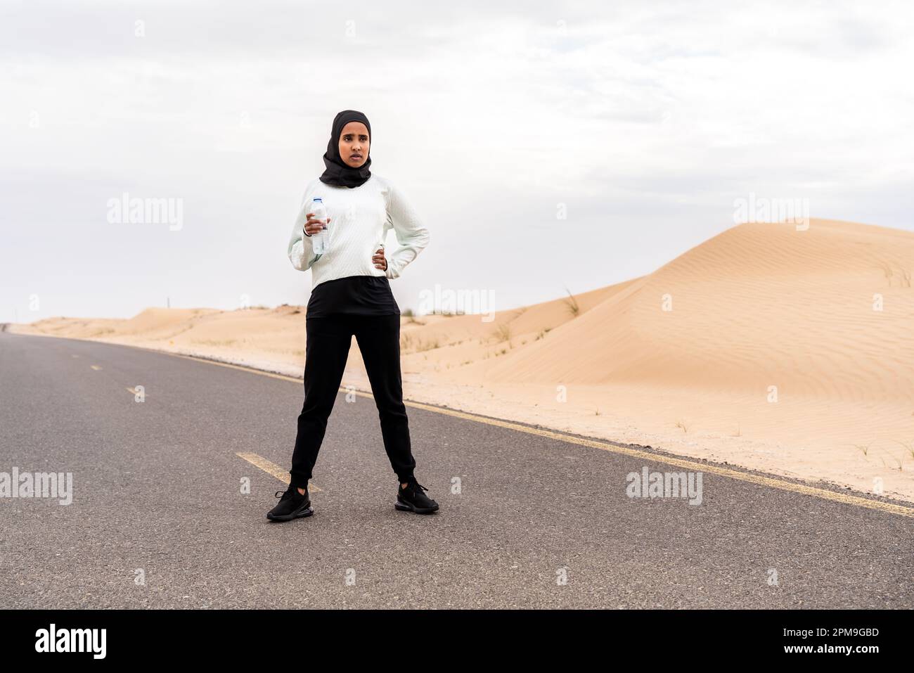 Beautiful middle-eastern arab woman wearing hijab training outdoors in ...