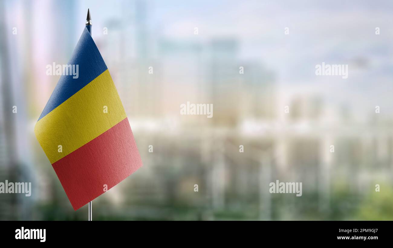 Small flags of the Romania on an abstract blurry background Stock Photo ...