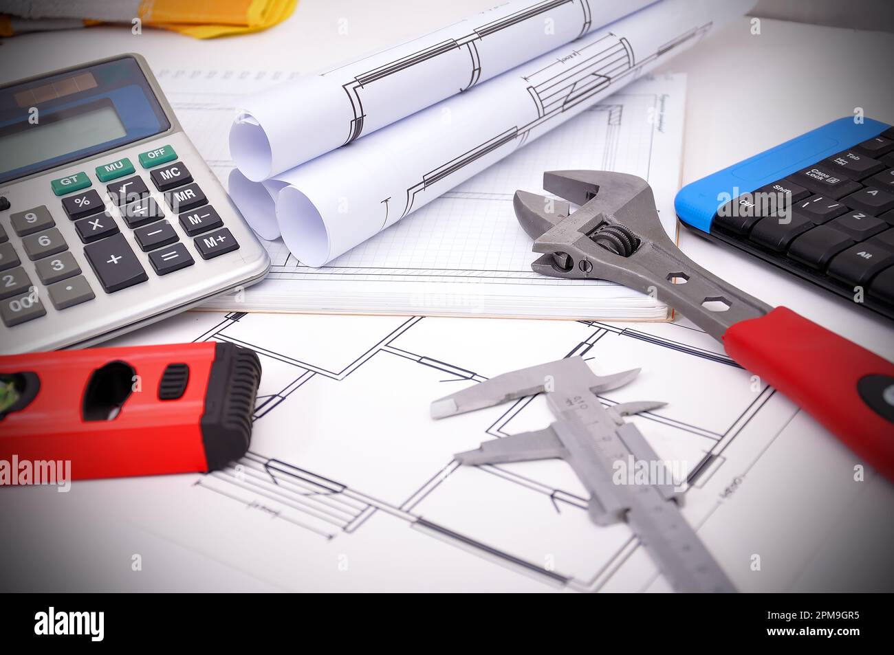 Construction drawings, caliper, tape line, calculator. Desk Engineer ...