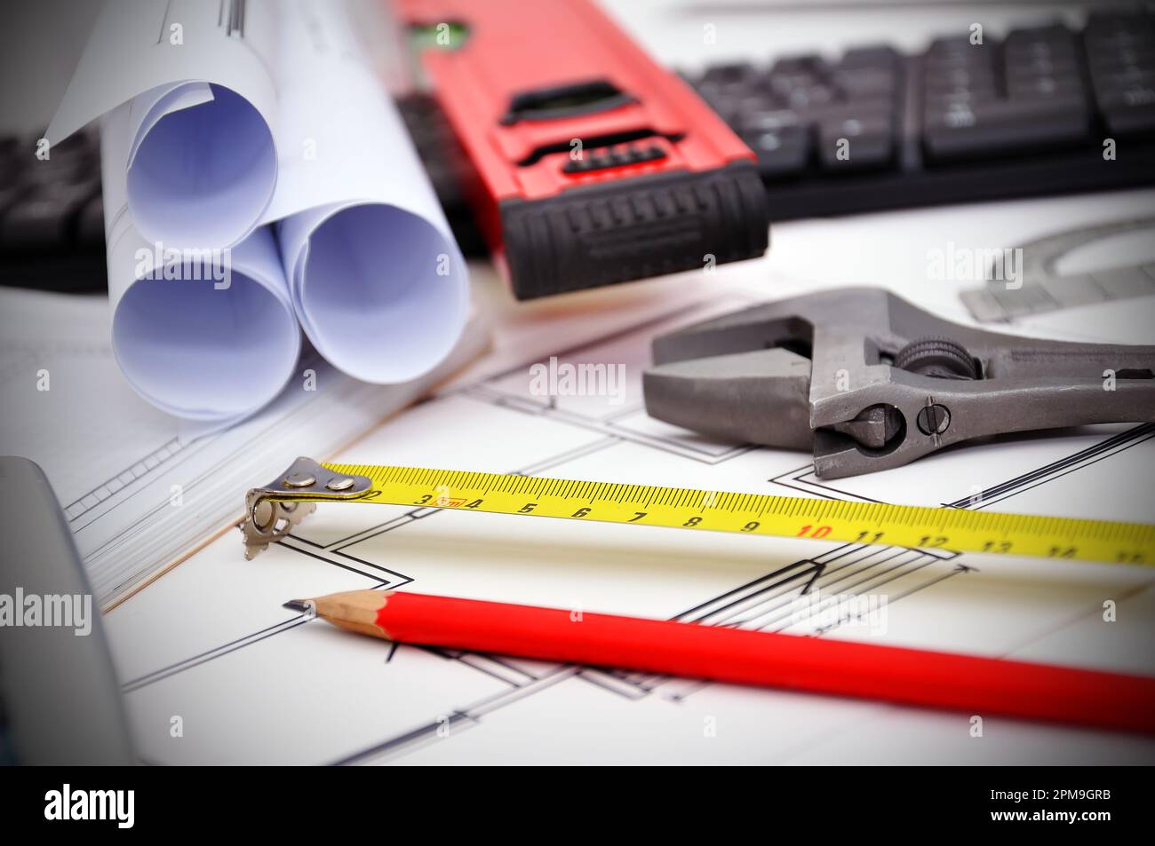 Desk Engineer, caliper, tape line and wrench Stock Photo - Alamy