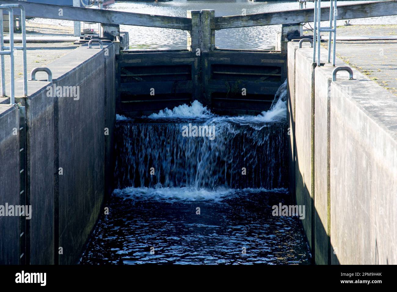 Partially open lock gate at a rural canal Stock Photo - Alamy