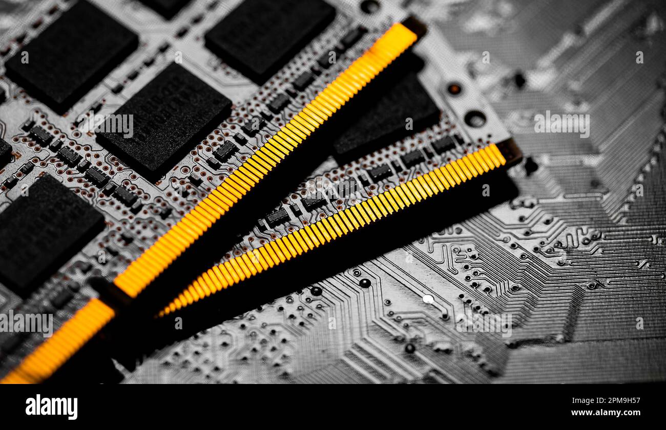 Macro Close up of computer RAM chip and motherboard on dark background ...