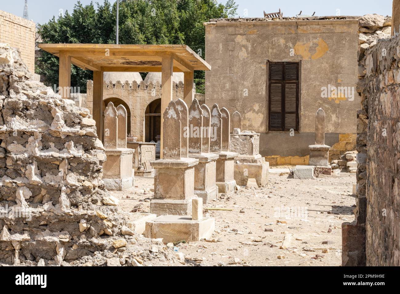 A street in the Cairo Necropolis / City of the Dead with cemetery and ...