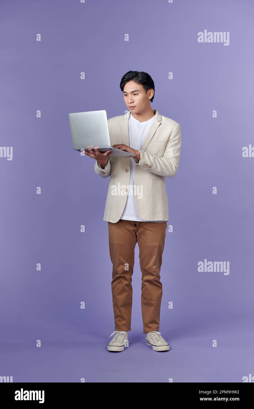 smart businessman isolated on purple, business success concept Stock ...