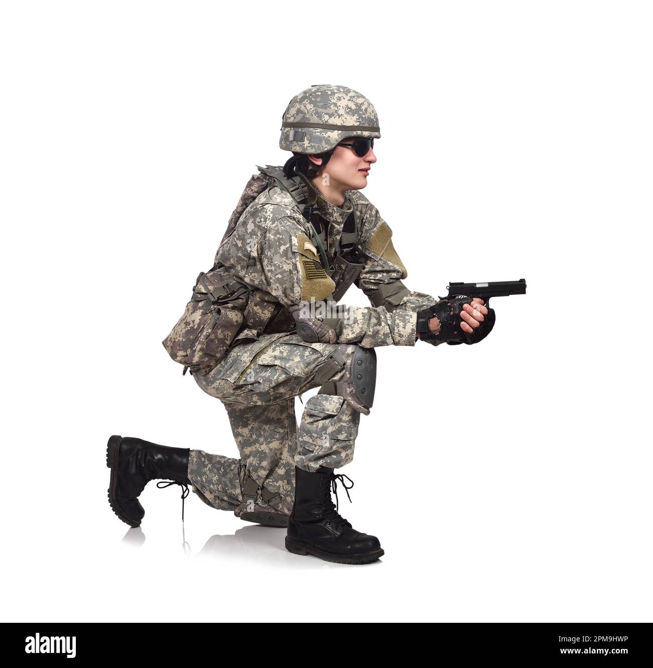USA soldier shoots a gun on gray background Stock Photo - Alamy