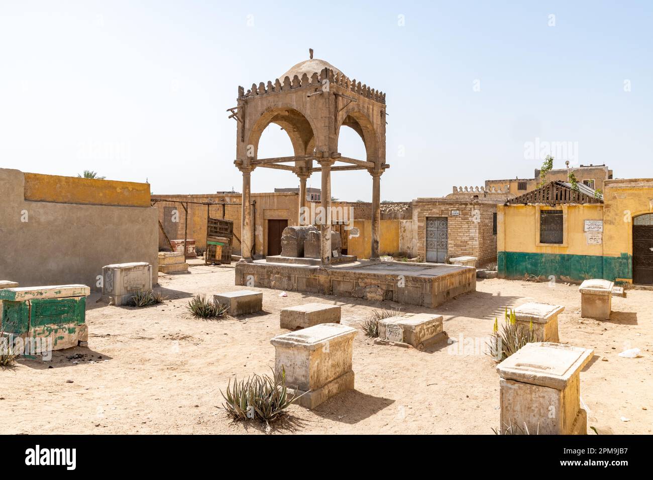 A street in the Cairo Necropolis / City of the Dead with cemetery and ...