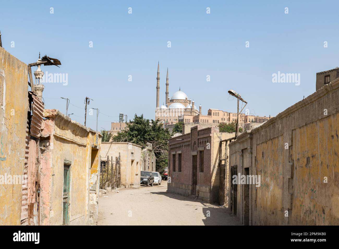 A street in the Cairo Necropolis / City of the Dead with cemetery and ...